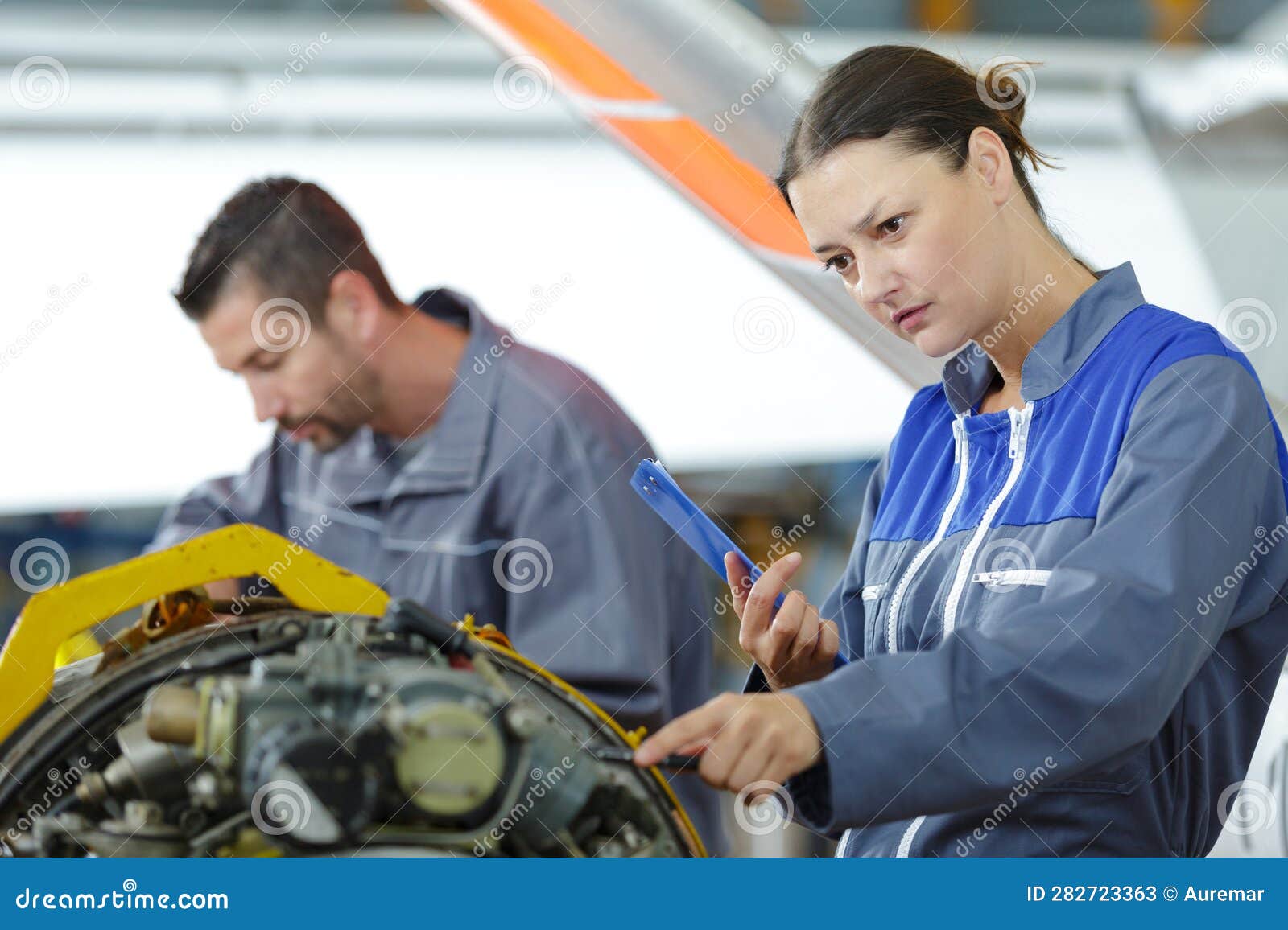 Two Aircraft Mechanics Doing Repairs Stock Image - Image of aviation ...