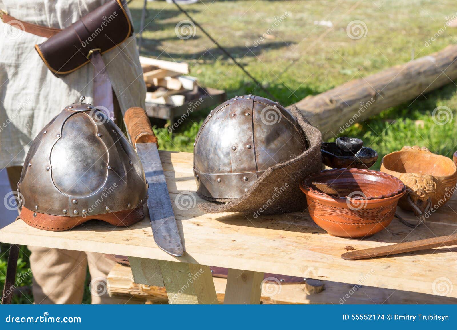 Two Ancient Helmet and Sword on Wooden Table Stock Photo - Image of ...