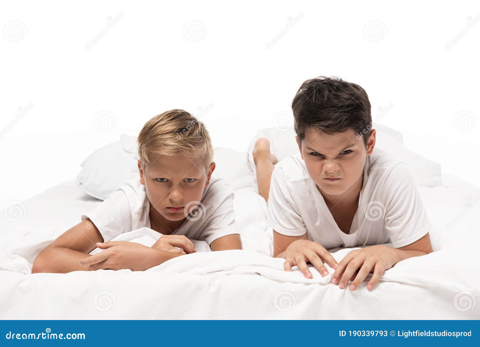 Two Angry Boys Standing Face To Face, Quarreling And Looking At Each ...