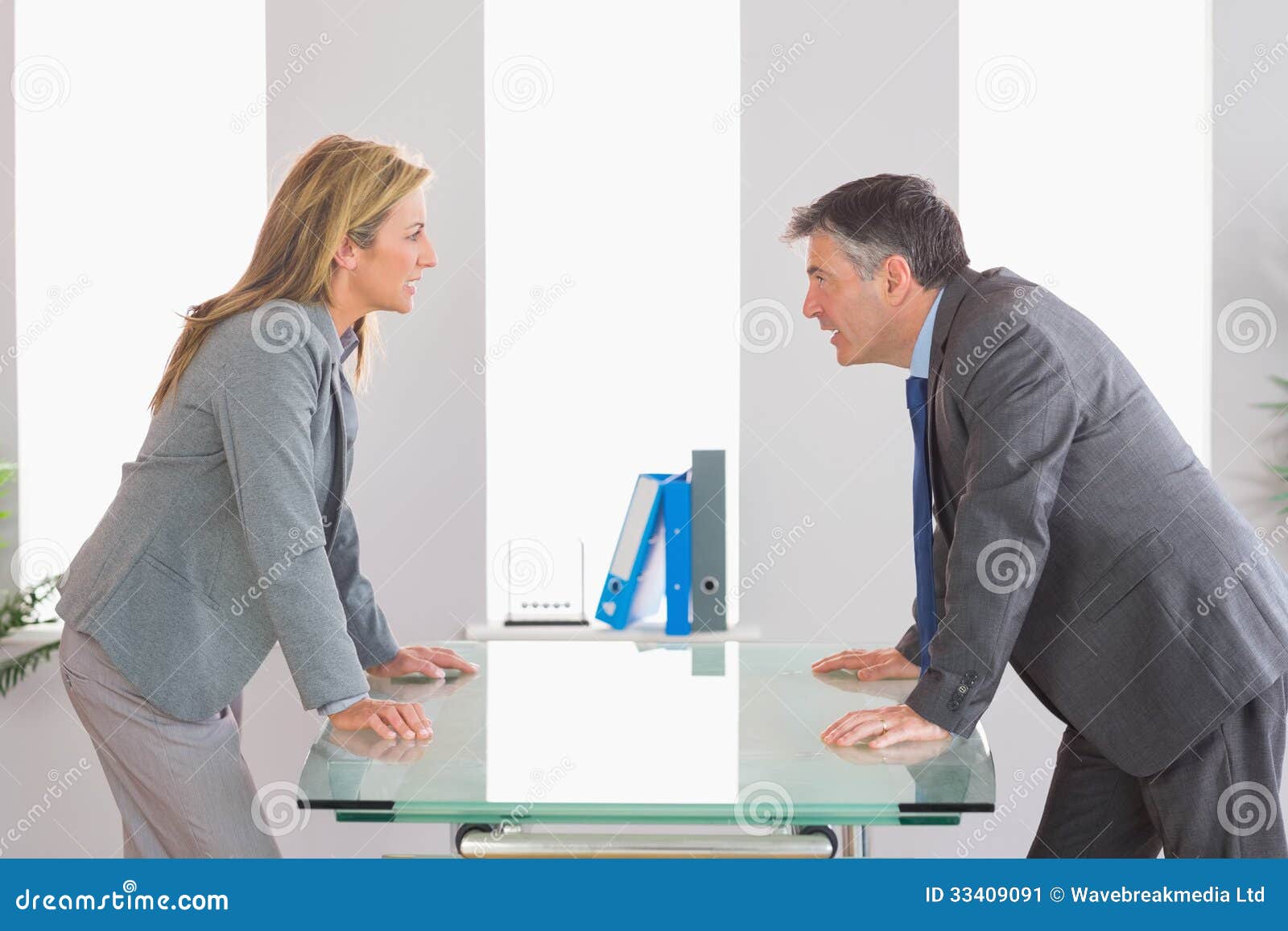 Two Angry Businesspeople Arguing on Each Side of a Desk Stock Image ...