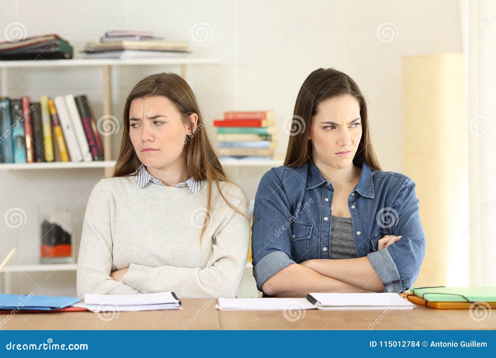 Two angry students at home stock photo. Image of distrust - 115012784