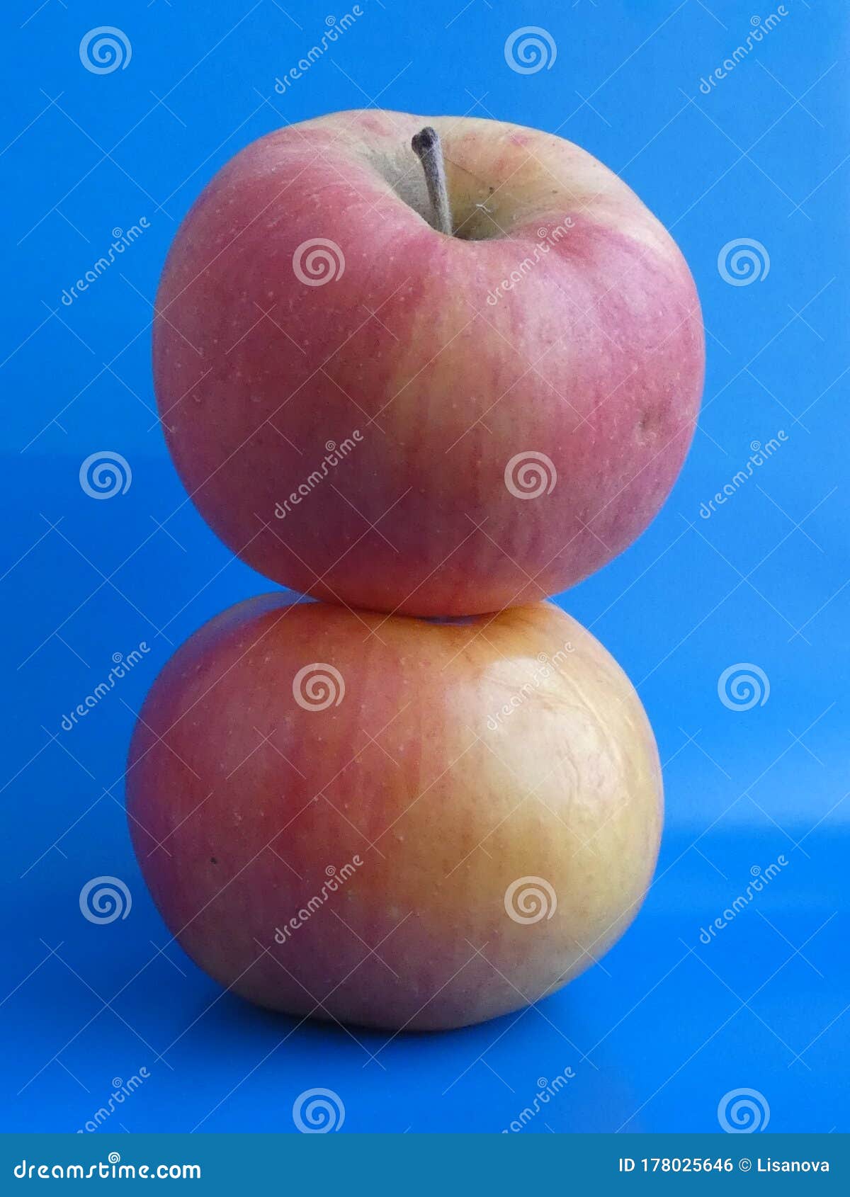 Two Apples On A Blue Background. Fruit Pyramid. Stock Photo ...