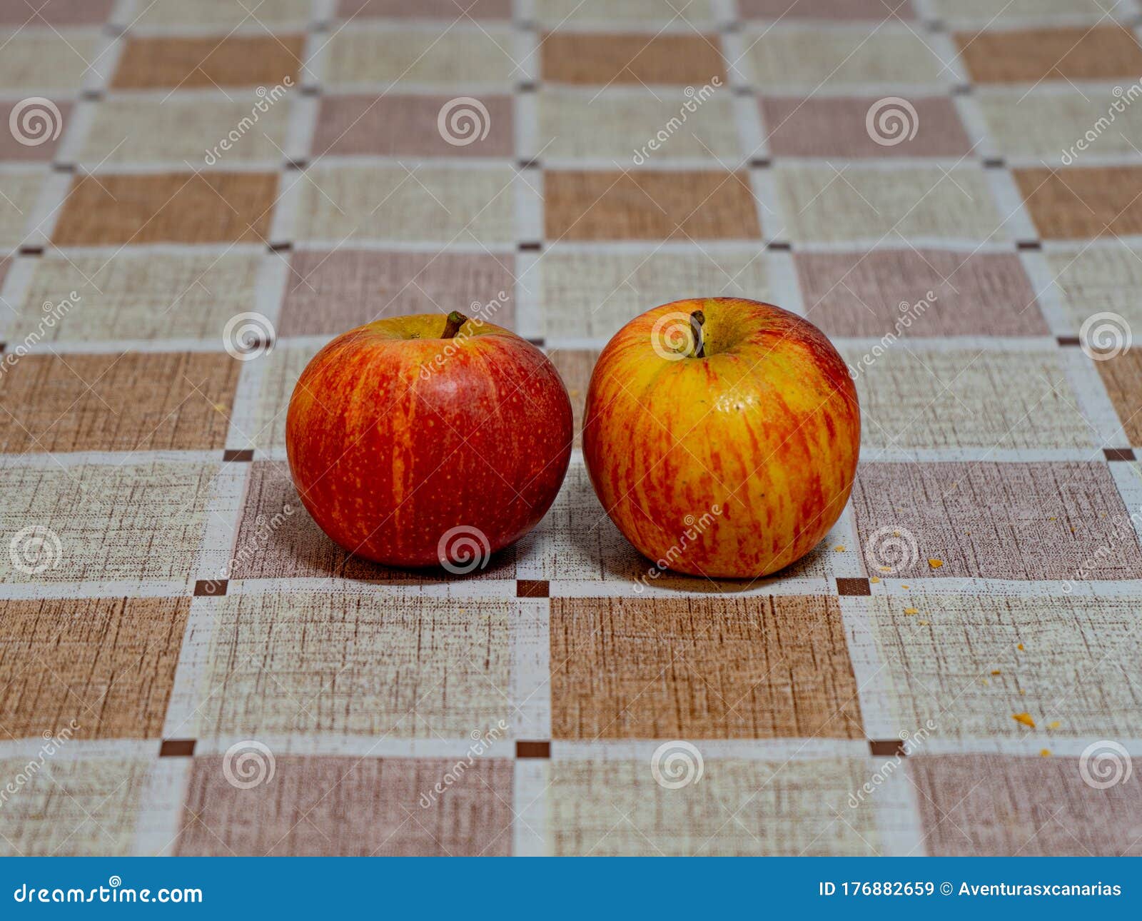 Two Apples on a Table with a Checkered Tablecloth. Stock Image - Image ...