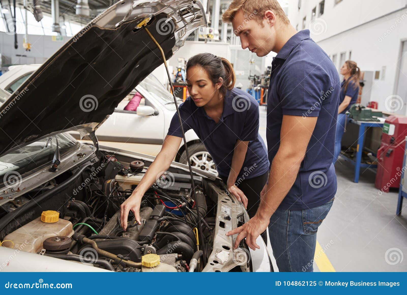 Two Apprentice Mechanics Looking at the Engine in a Car Stock Image ...