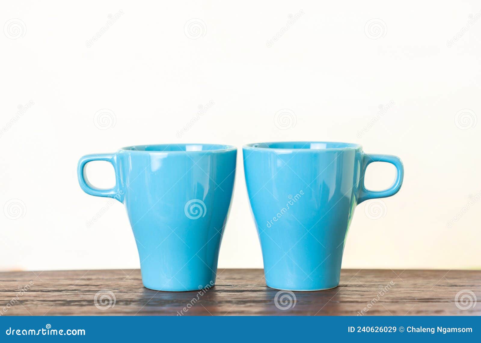 Two Aqua Blue Cups on Wood Table with Isolate White Background Stock ...