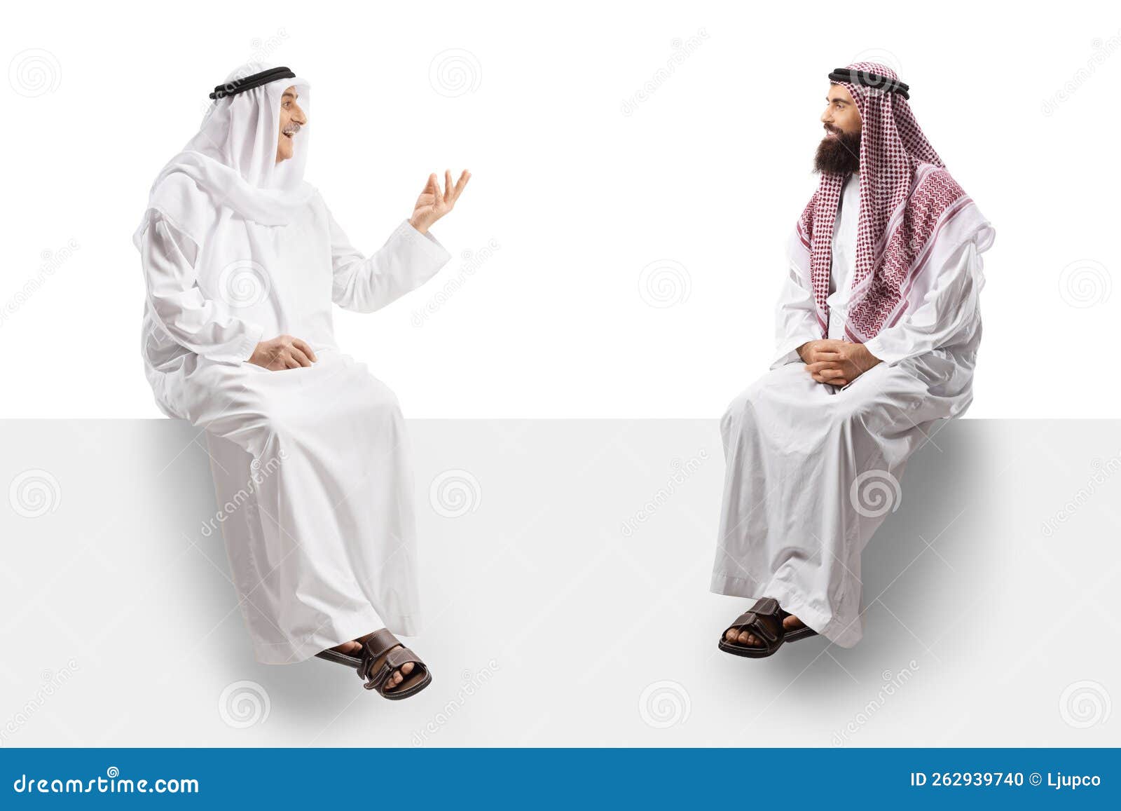 Two Arab Men Seated on a White Panel Having a Conversation Stock Photo ...