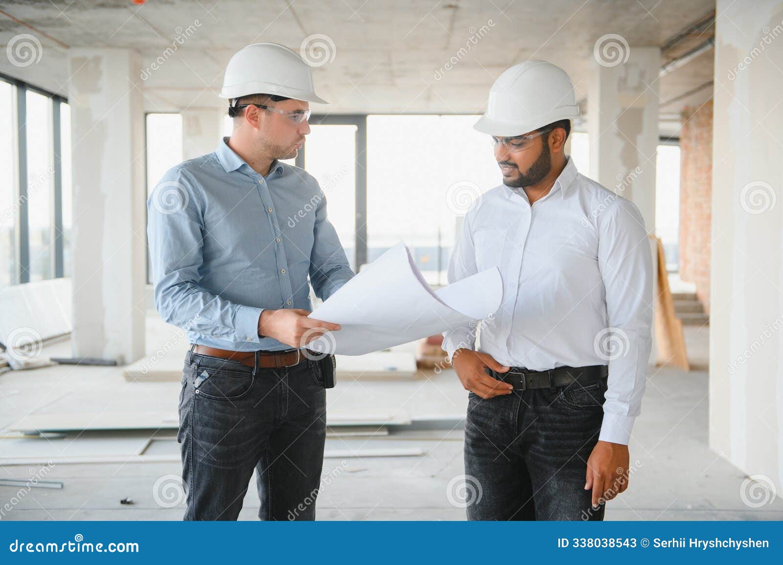 Two Architect Engineers Talking in a Constructed Office Building Stock ...