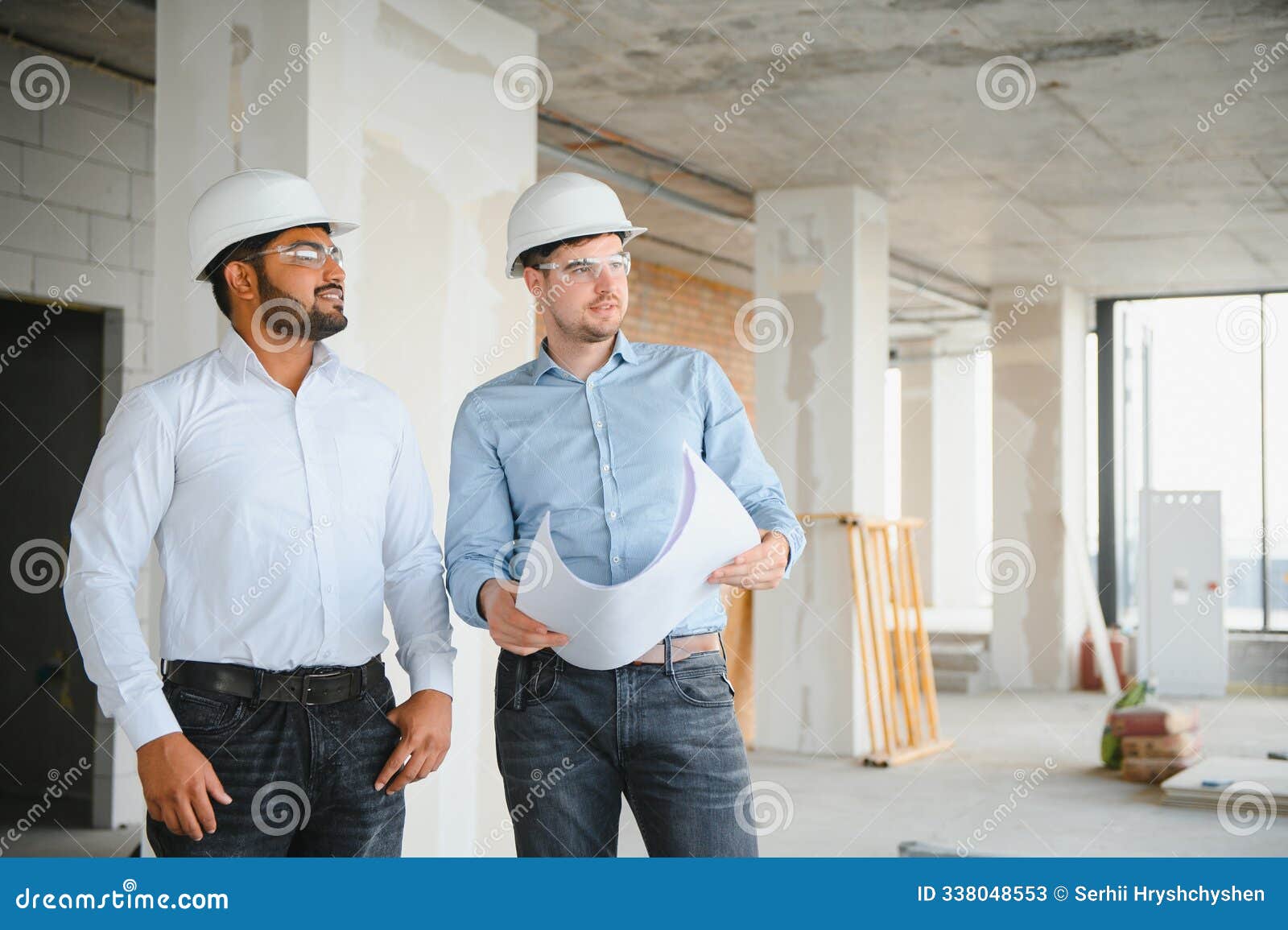 Two Architect Engineers Talking in a Constructed Office Building Stock ...