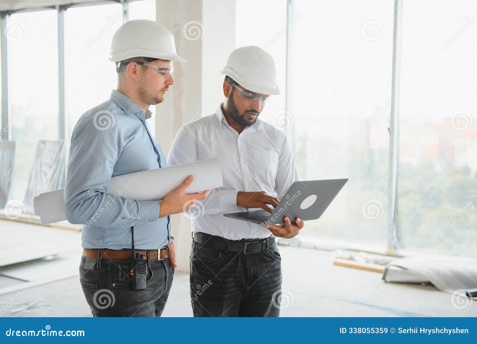 Two Architect Engineers Talking in a Constructed Office Building Stock ...