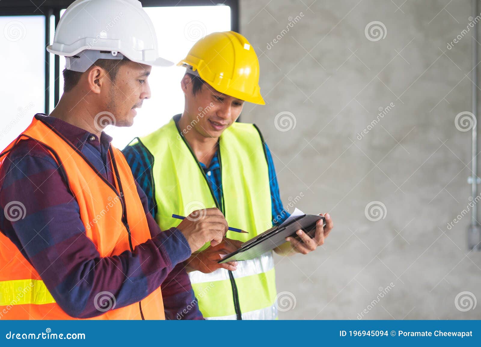 Two Architect Look at Document and Planning To Renovation Room ...