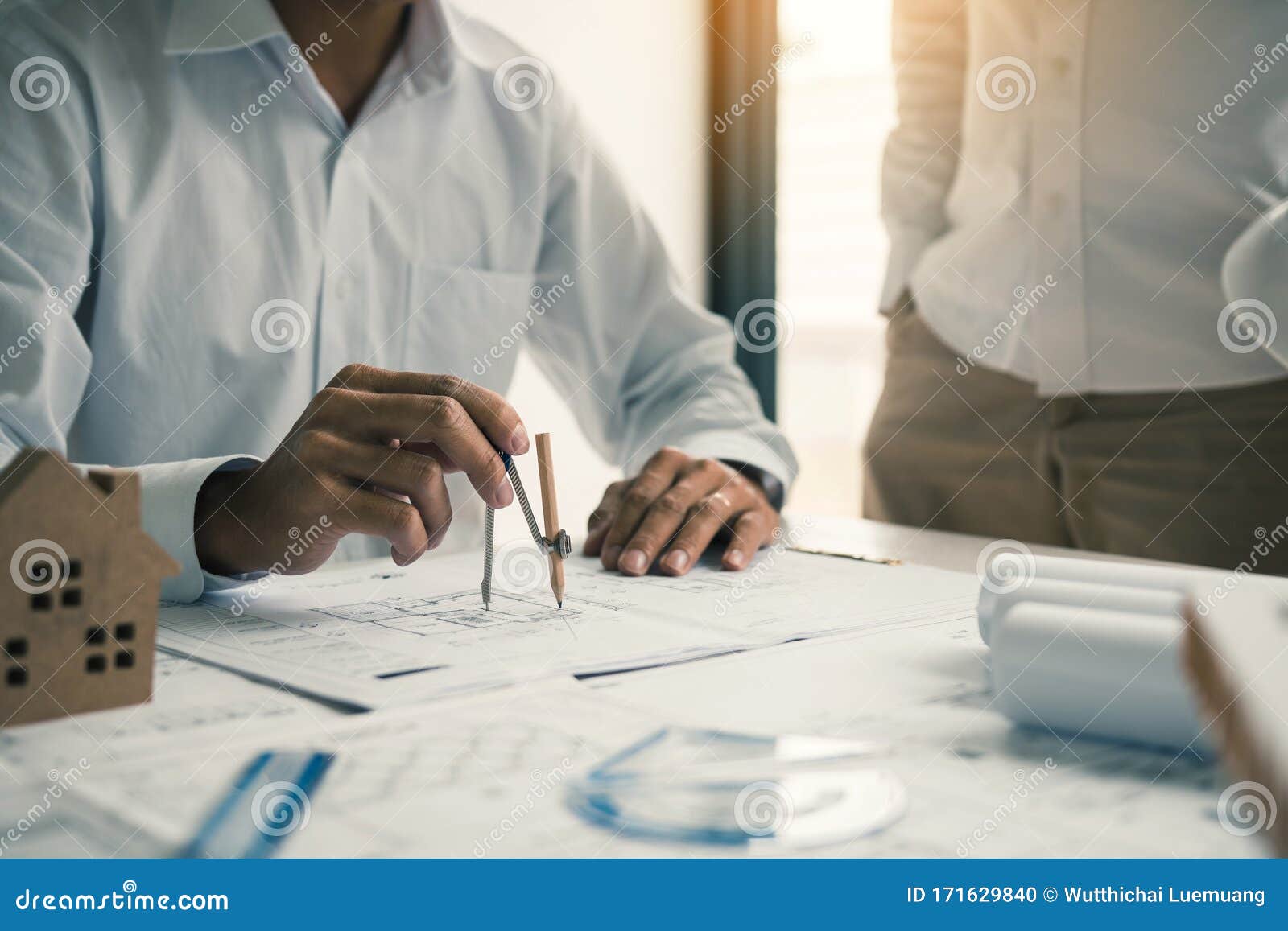 Two Architect Working at Construction Site and Compass Drawing Pointing ...