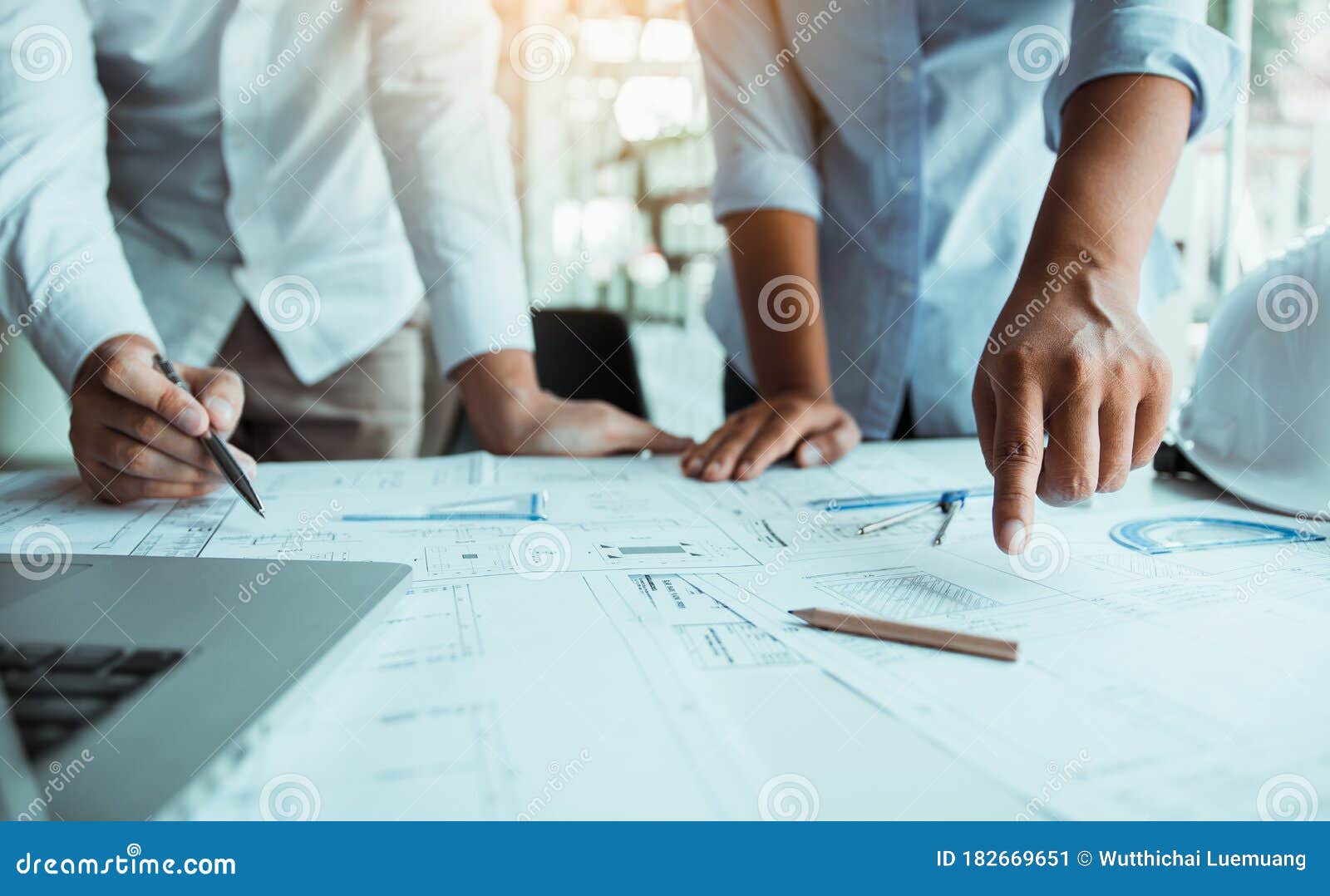 Two Architect Working at Construction Site and Compass Drawing Pointing ...