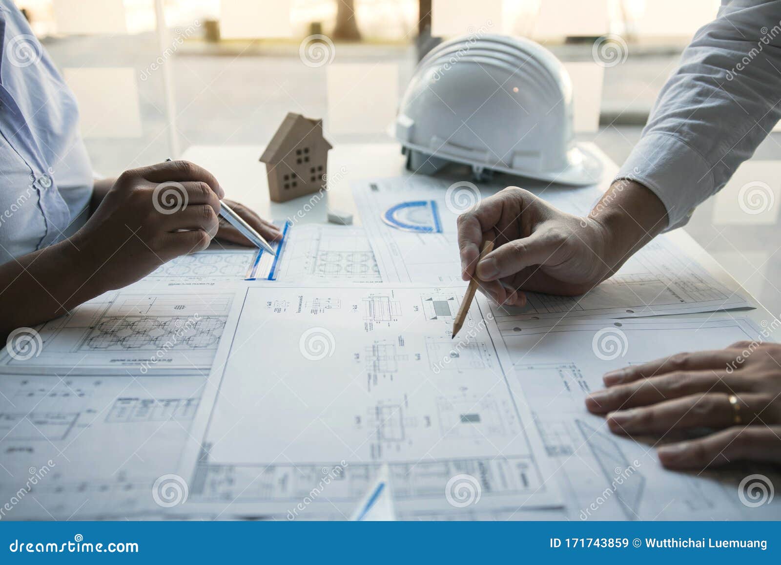 Two Architect Working at Construction Site and Compass Drawing Pointing ...