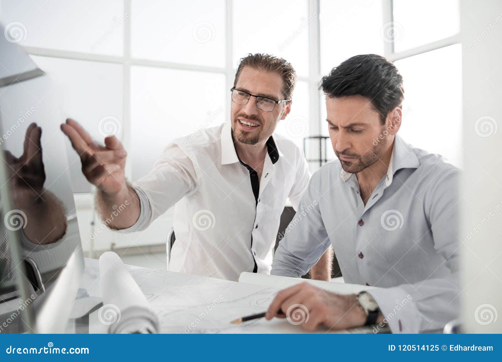 Two Architects Discussing the Project in the Office Stock Image - Image ...