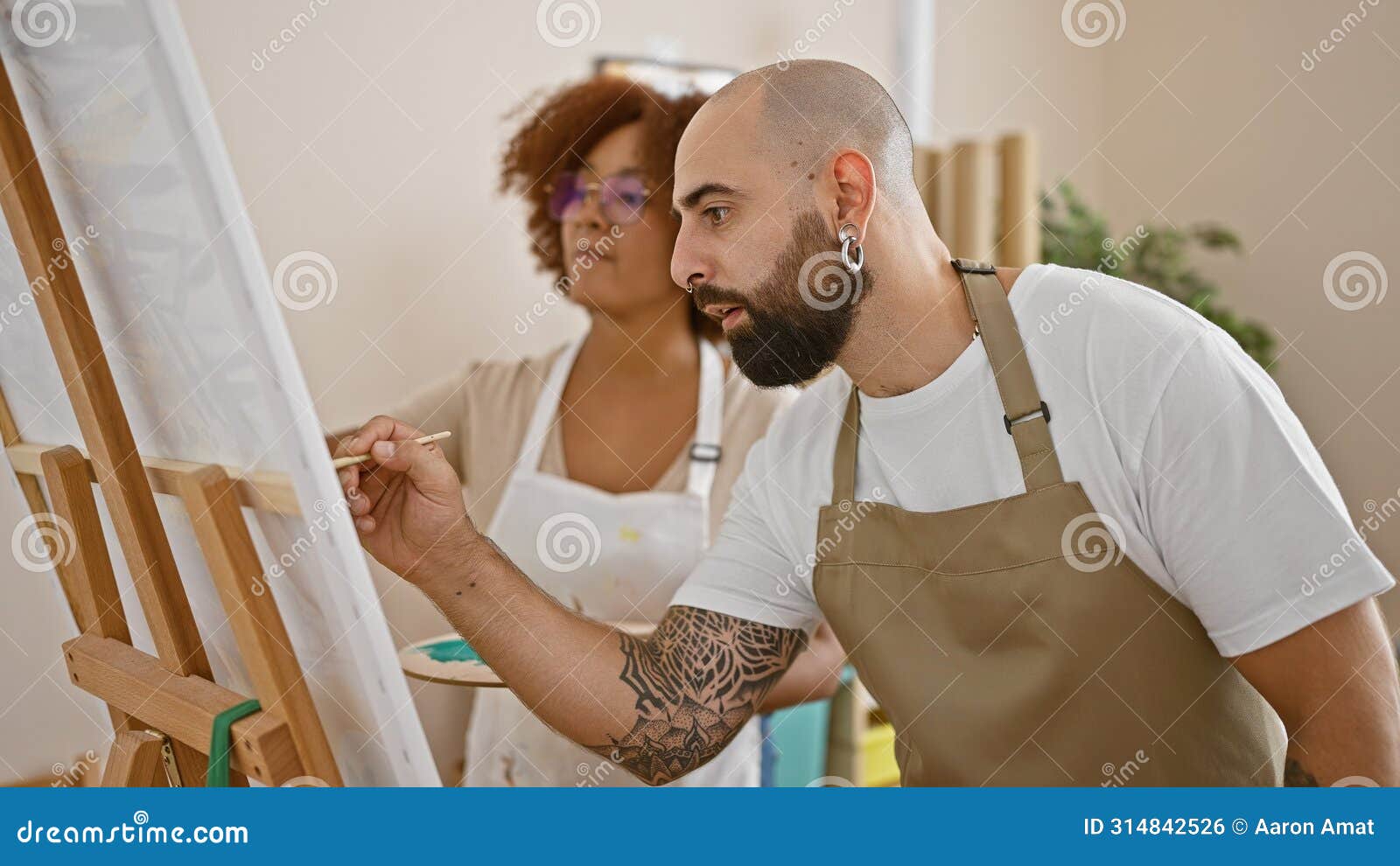 Two Artists Drawing Together Looking Upset at Art Studio Stock Photo ...