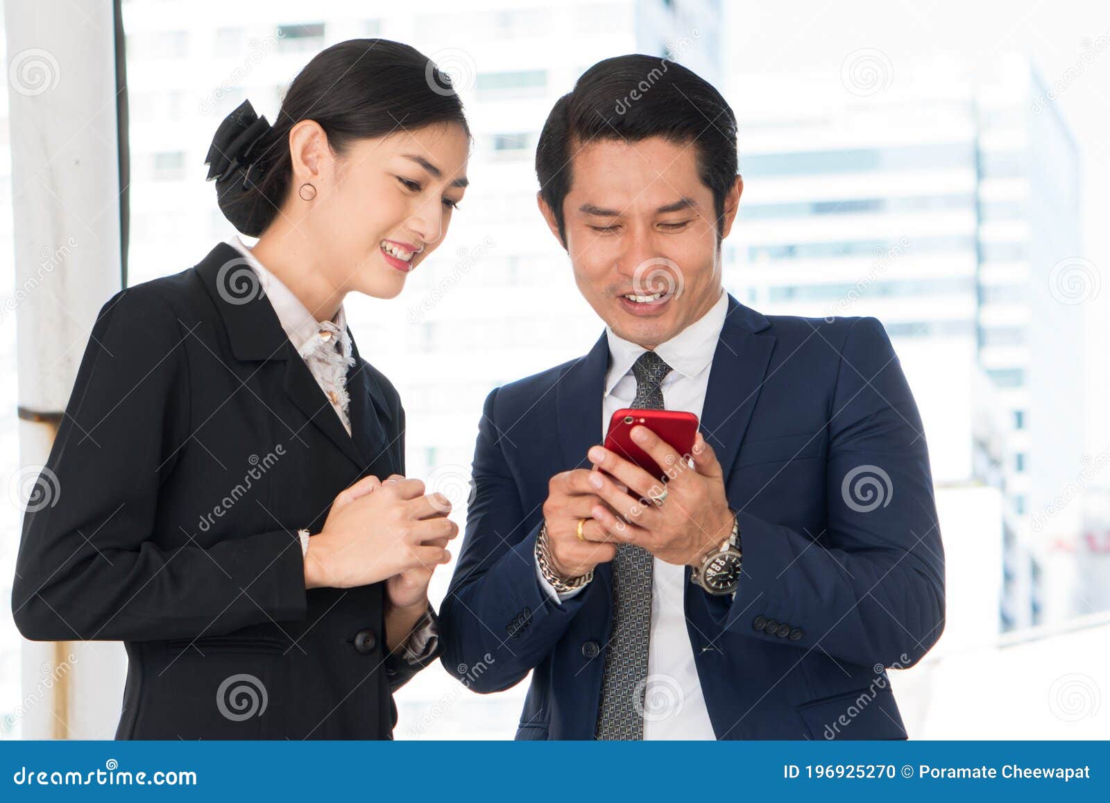 Two Asian Business People Smiling and Having Fun Chit Chat in Workplace ...