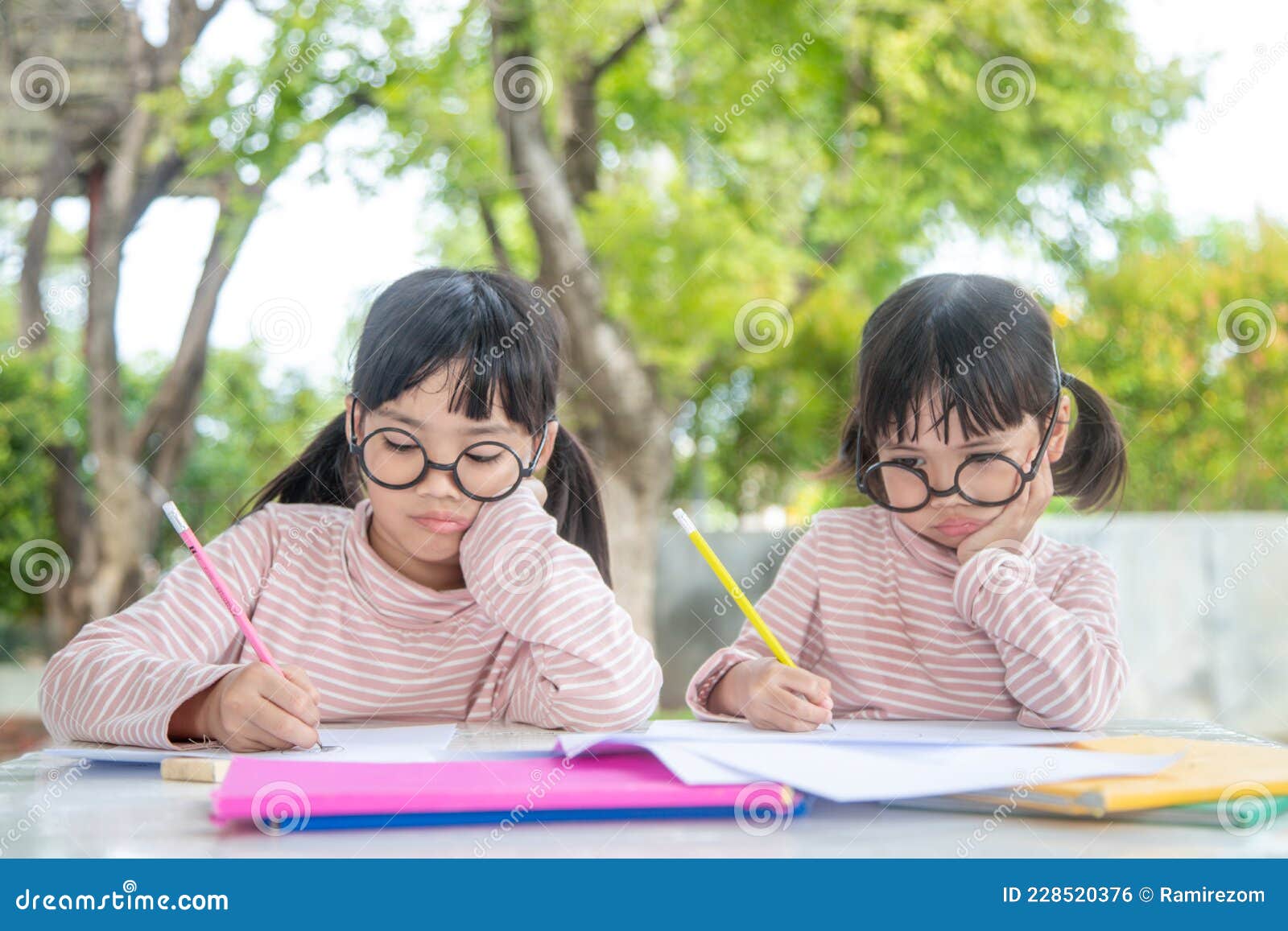 Two Asian Children Doing Homework Together at Home Stock Photo - Image ...