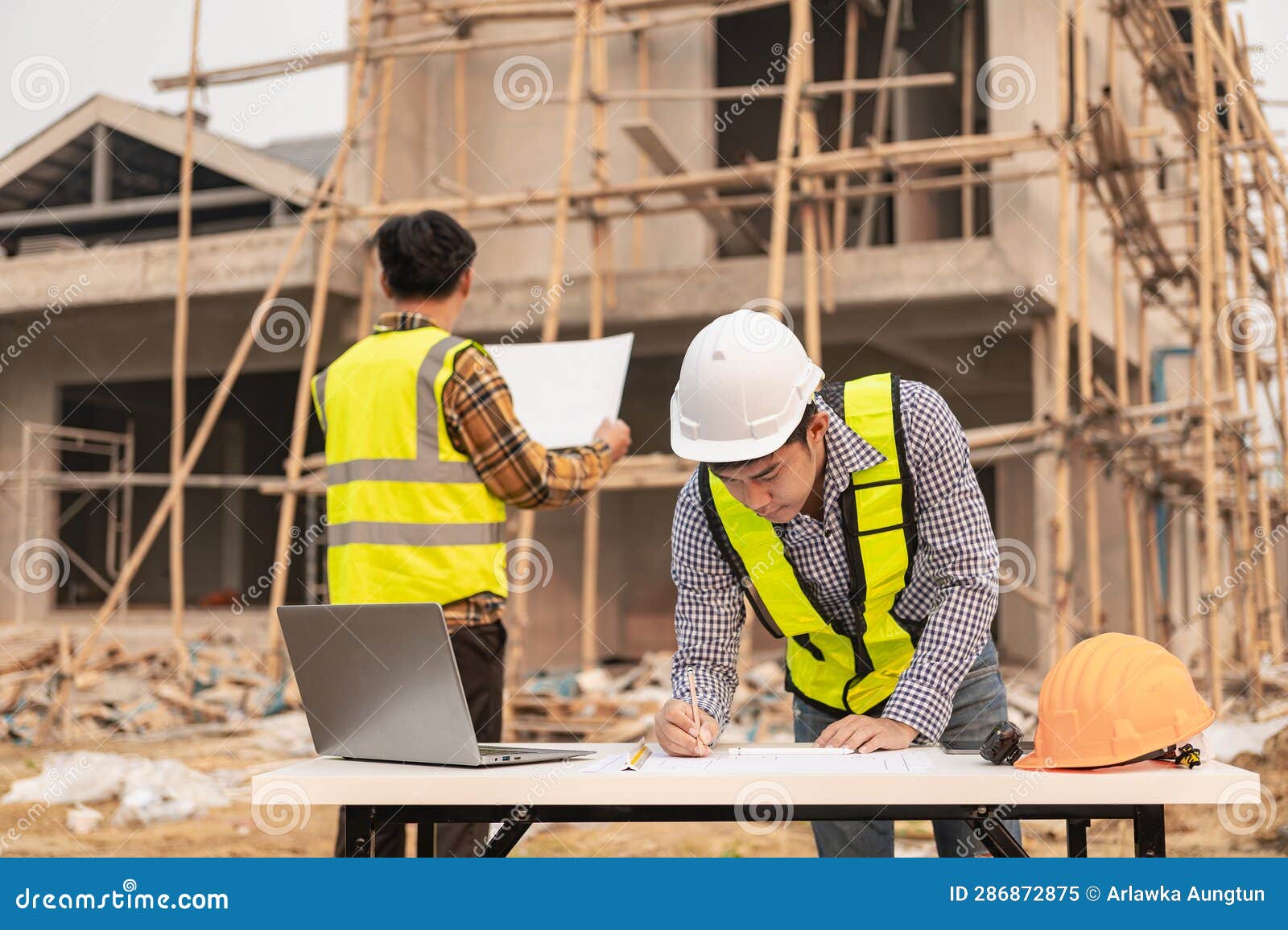 Two Asian Male Engineers Shaking Hands and Working Together Hope Stands ...
