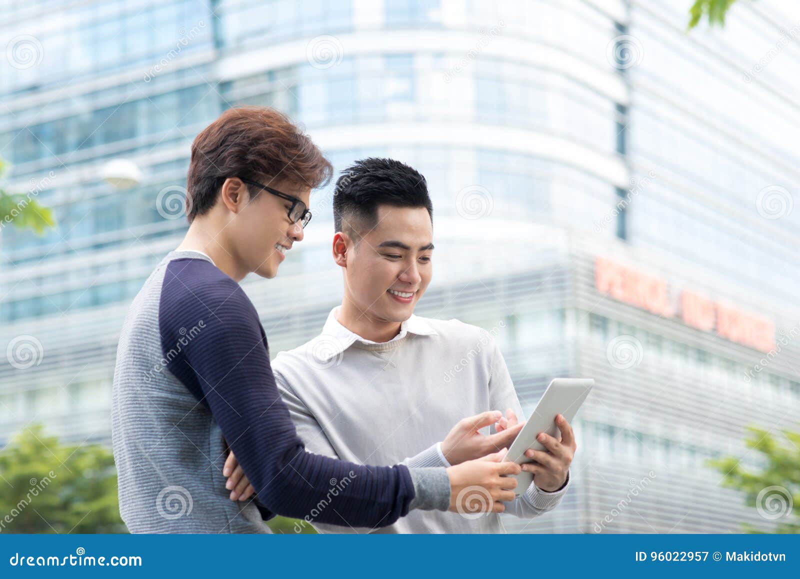 Two Asian Man Sitting in Cafe and Discussing Stock Image - Image of ...