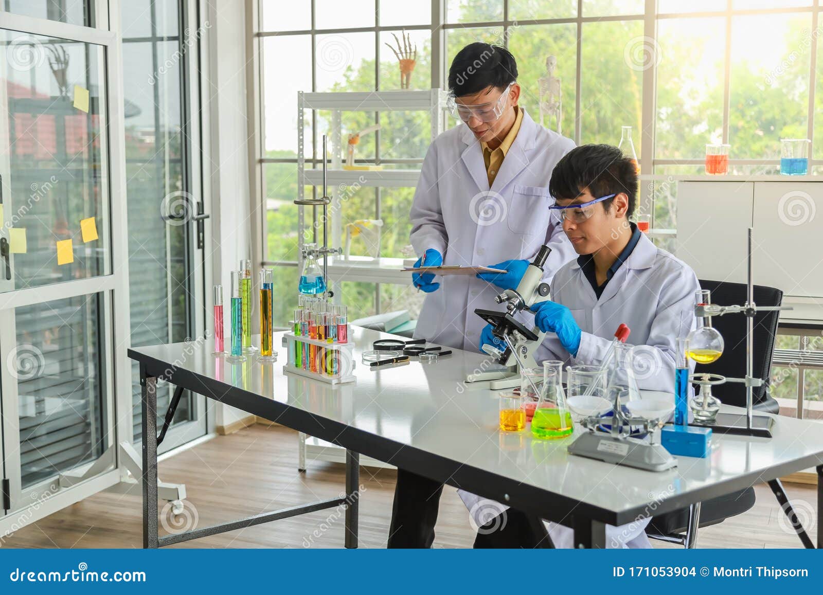Two Asian Professional Senior and Young Doctor Scientist Using ...