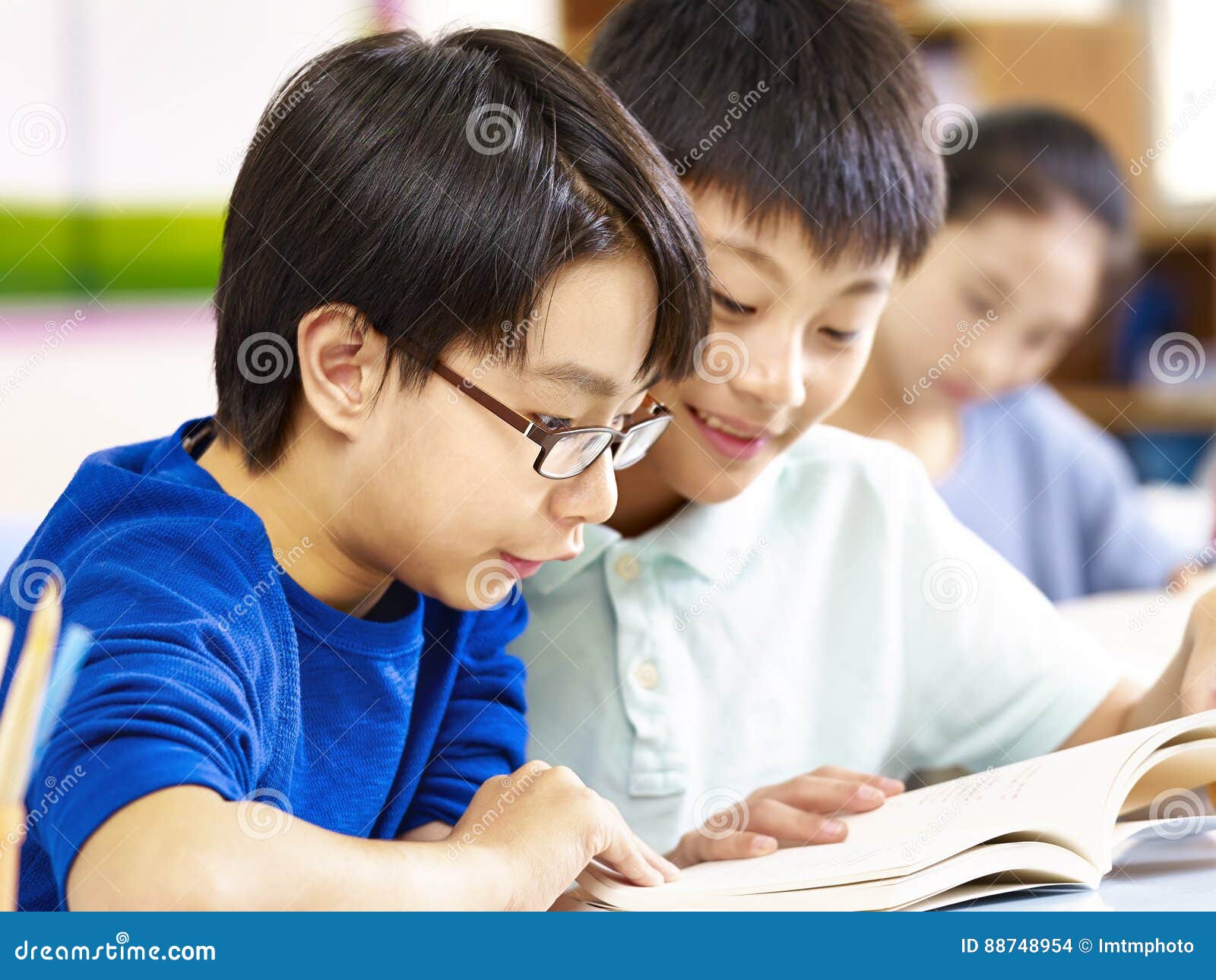Two Asian Pupils Studying Together in Classroom Stock Photo - Image of ...