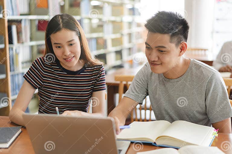 Two Asian Students Researching for Project in Library Stock Image ...
