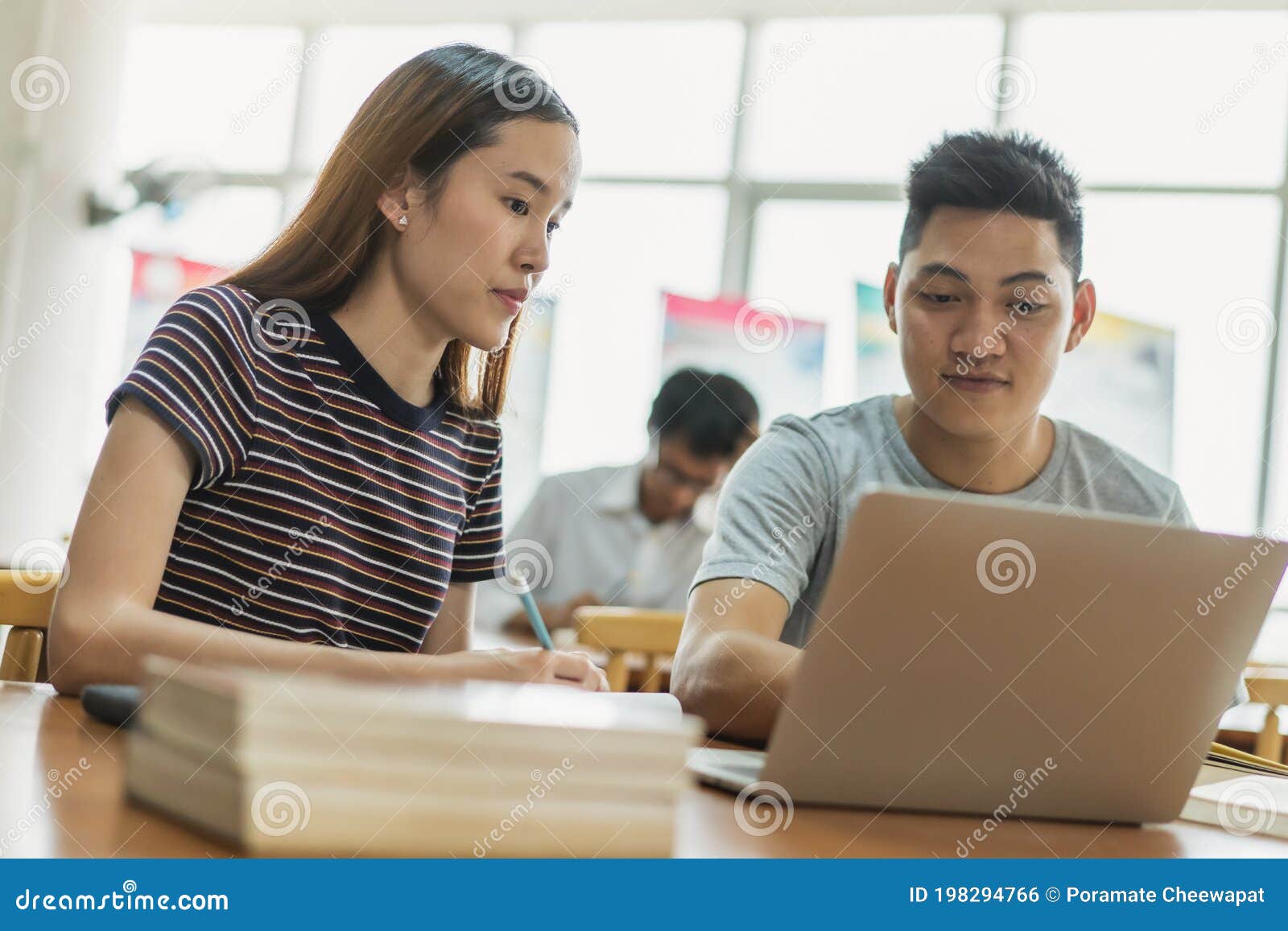 Two Asian Students Researching for Project in Library Stock Photo ...