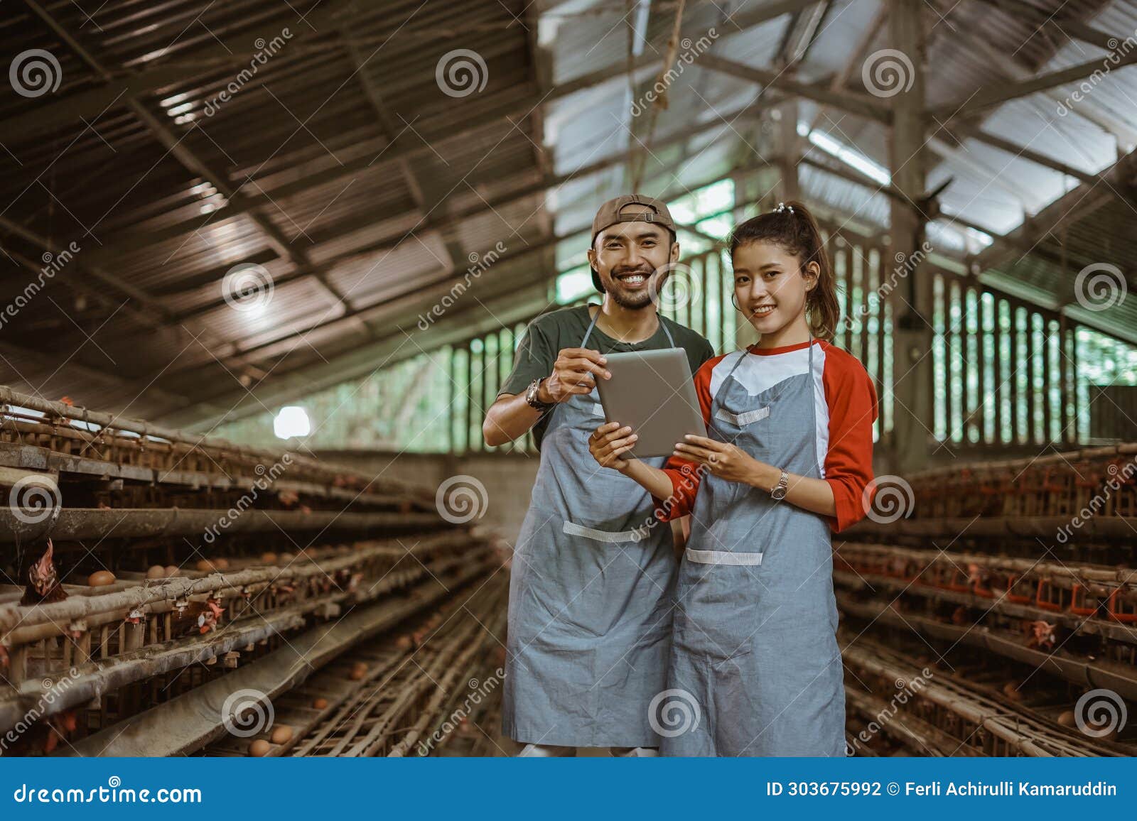 Two Asian Workers Smile when Using a Tablet Together Stock Photo ...