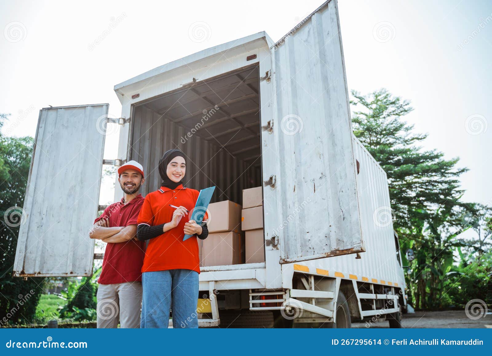 Two Asian Workers Standing Behind a Logistics Container Truck Stock ...