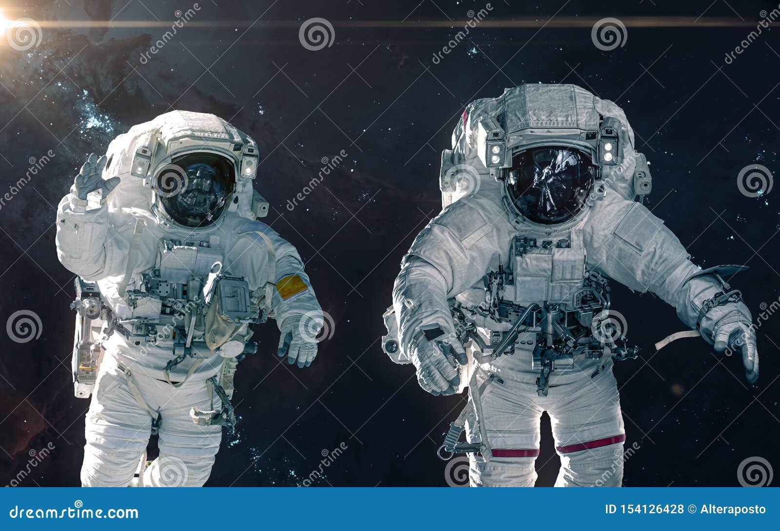 Two Astronauts on Background of Nebulae and Star Clusters. Deep Space ...