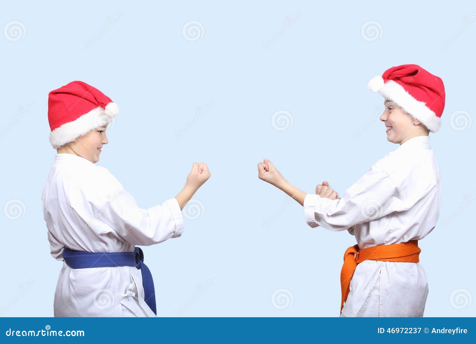 Two Athletes in Caps of Santa Claus Standing in Rack of Karate Stock ...