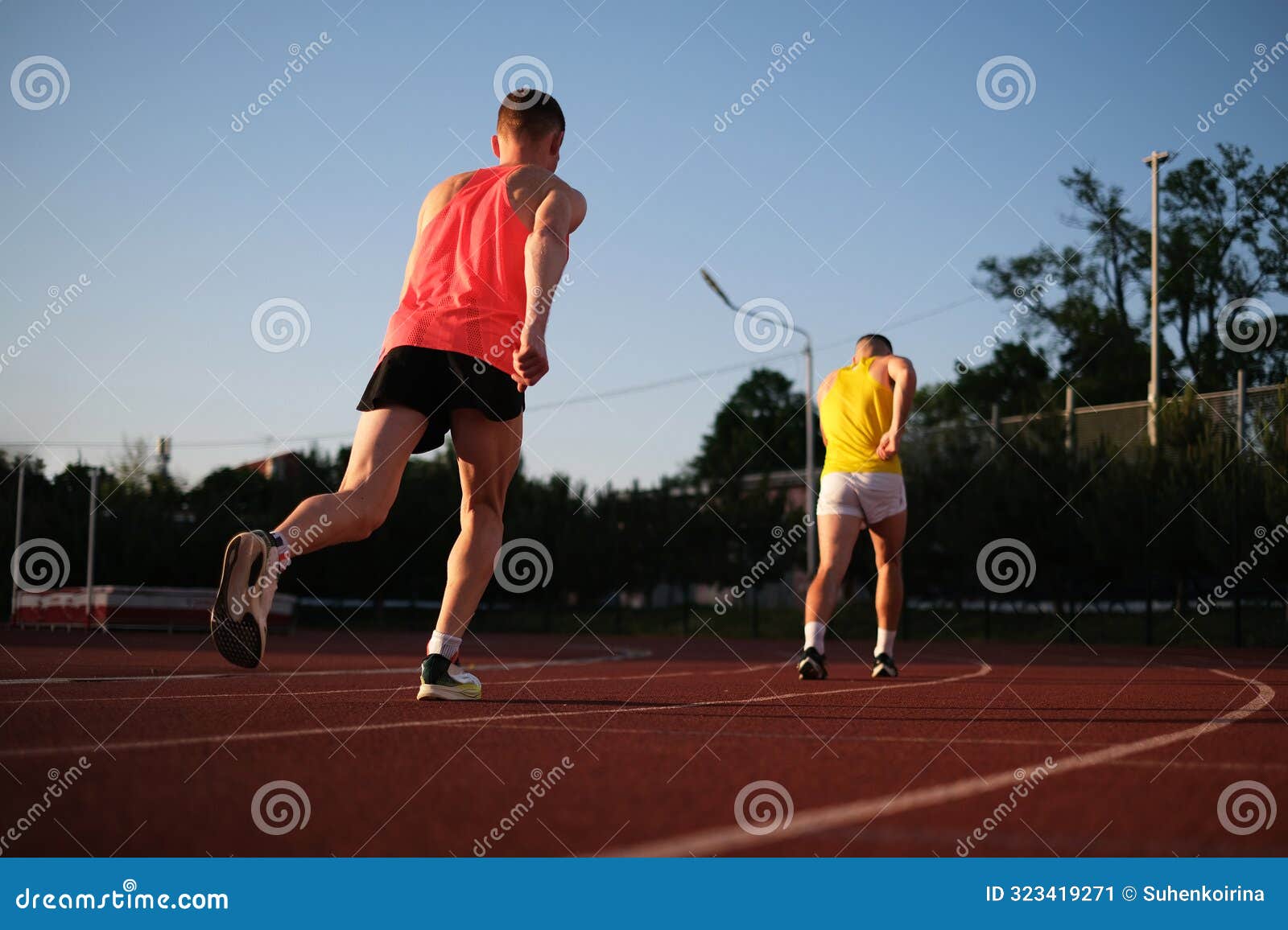 Two Athletes Compete in Running at the Stadium Stock Image - Image of ...