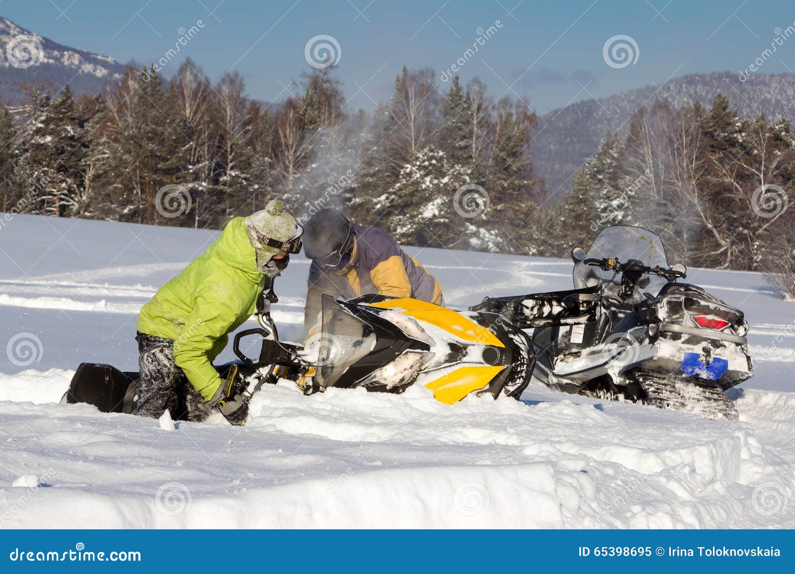 Two Athletes Pull a Snowmobile. Stock Image - Image of sports, frost ...