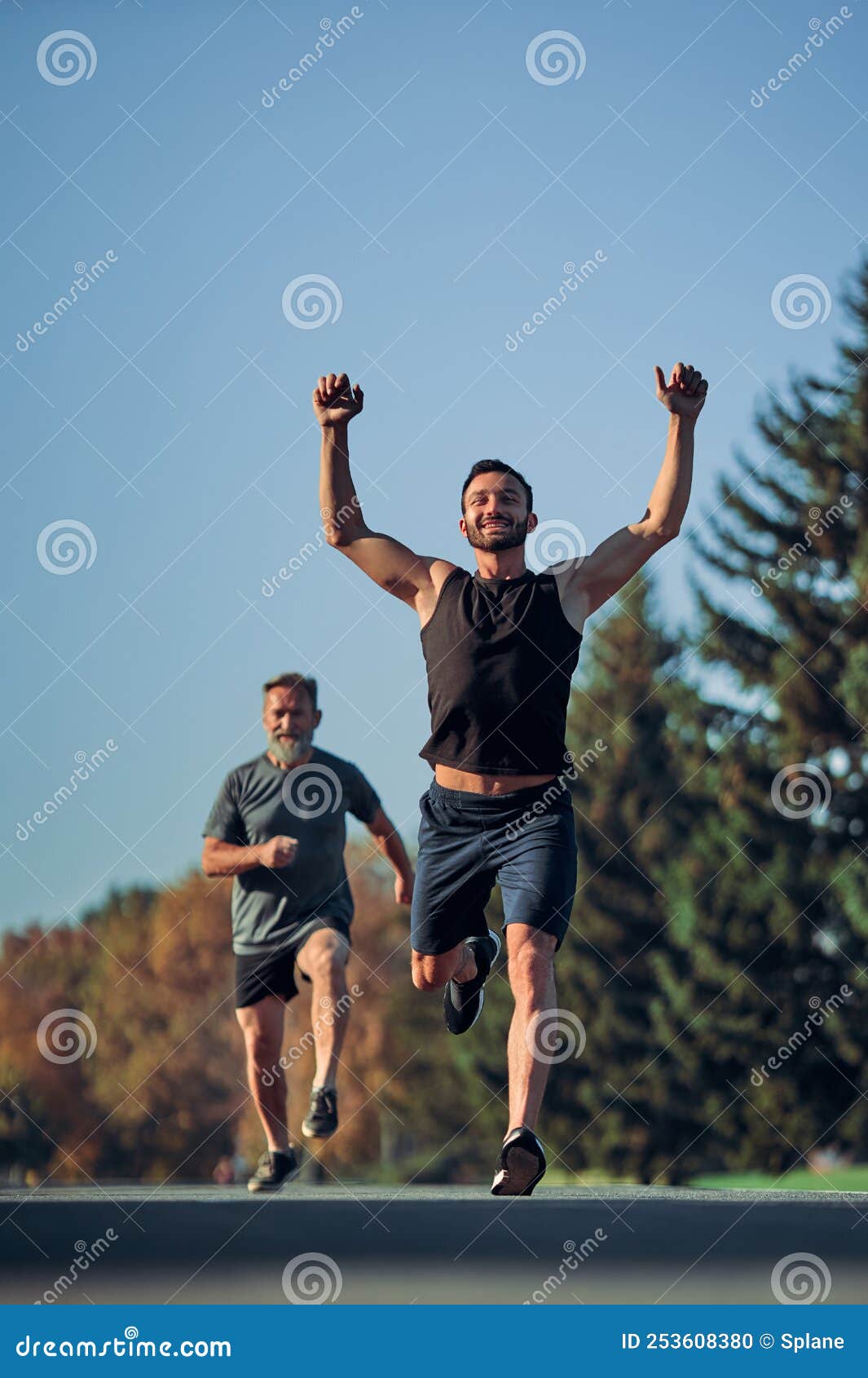 The Two Athletes Running Marathon in the Beautiful Park. Stock Photo ...