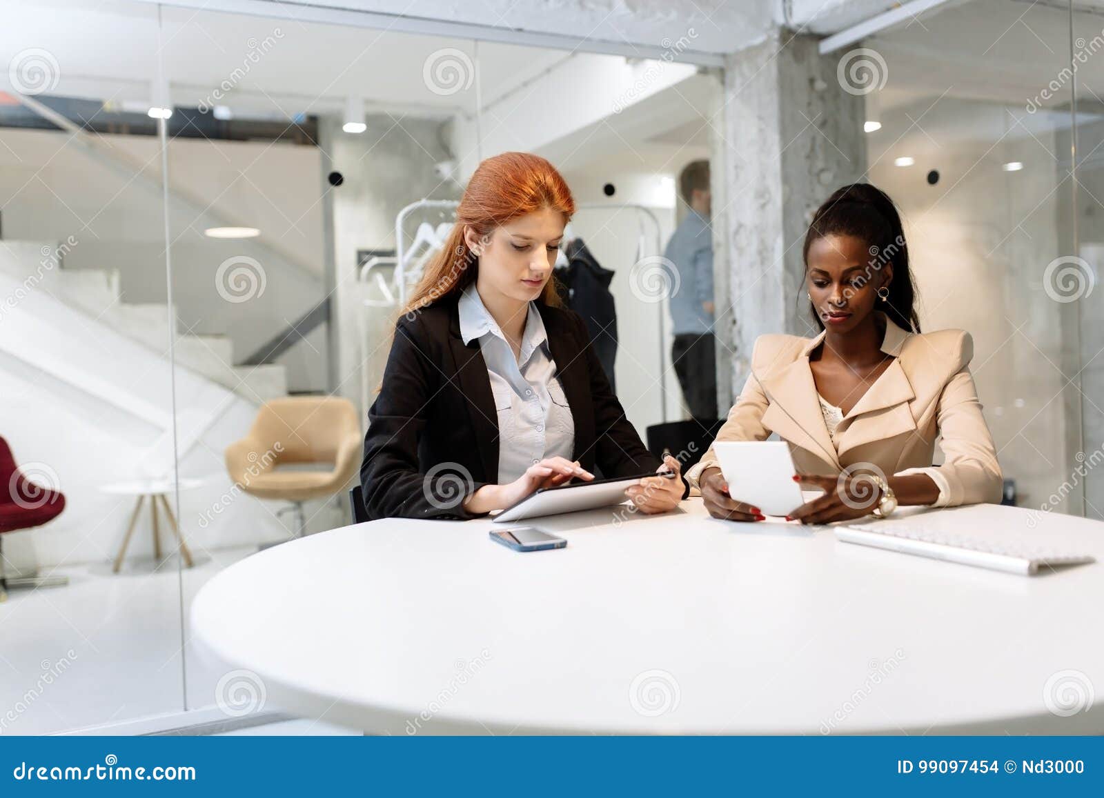Two Attractive Businesswomen Using Technology Stock Photo - Image of ... Two Attractive Businesswomen Using Technology Stock Photo - Image of ...
