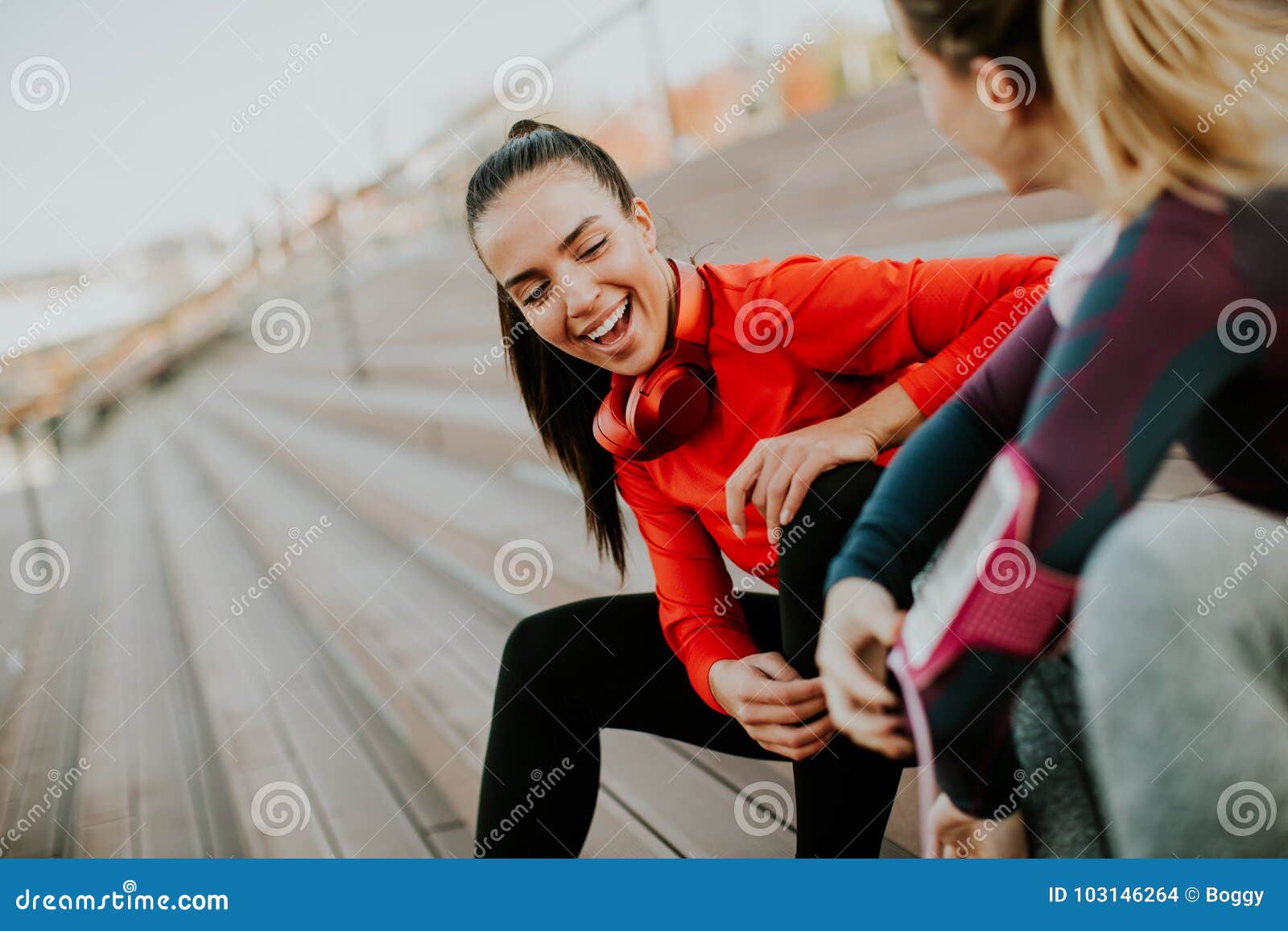 Two Attractive Female Runner Taking Break after Jogging Outdoors Stock ...