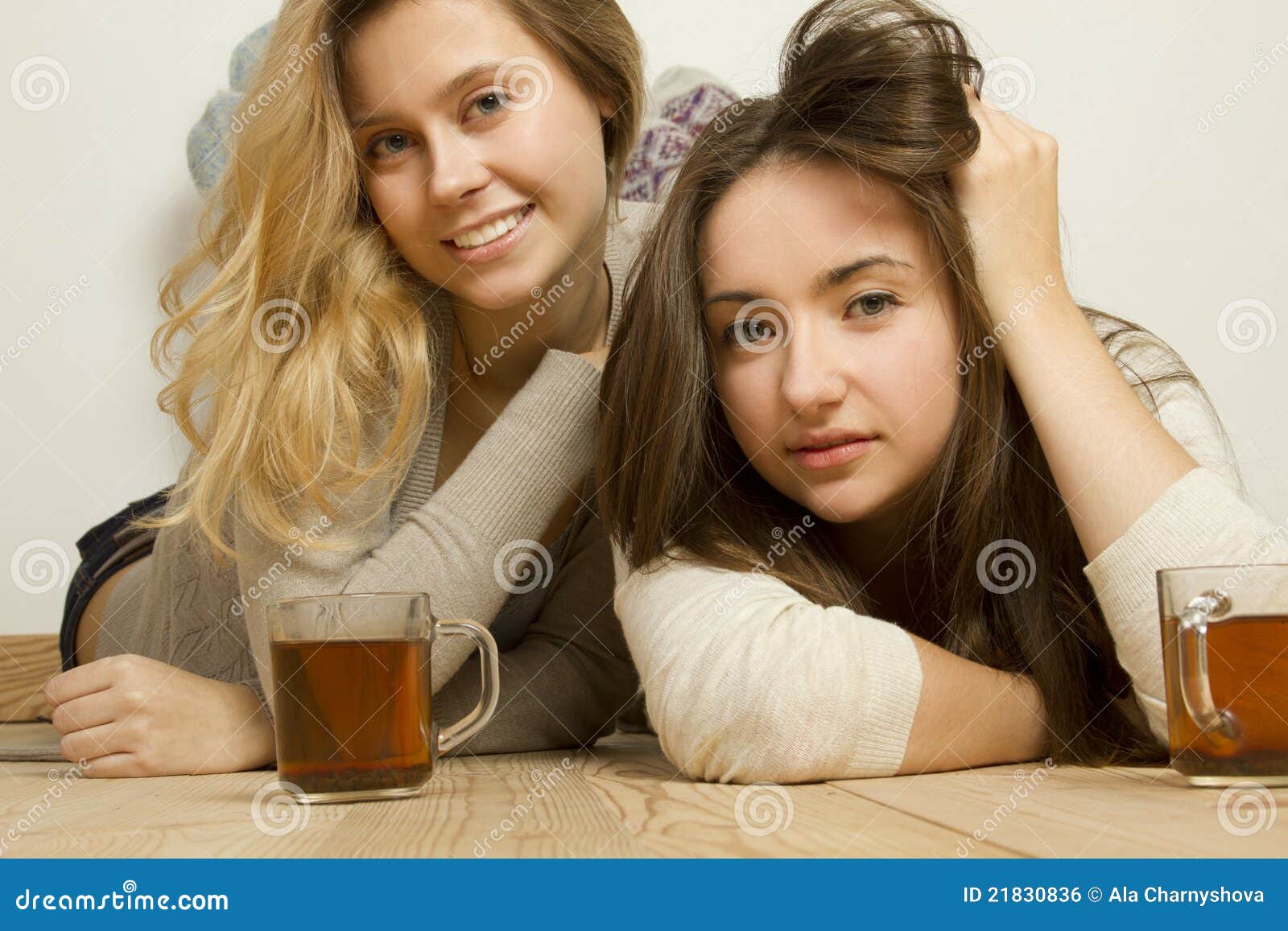 Two Attractive Friends Drinking Tea Stock Photo - Image of life, foot ...