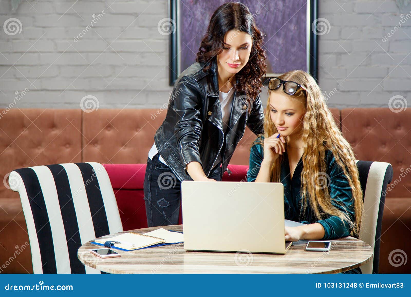 Two Attractive Girls Discuss the Video Course Stock Photo - Image of ...