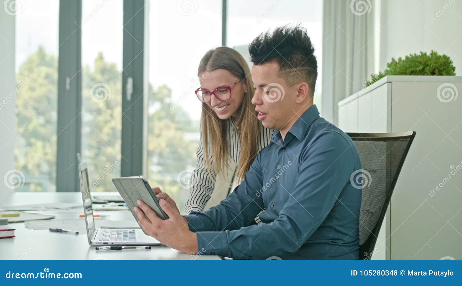 Two People Discussing Ideas Using Digital Tablet Stock Photo - Image of ...