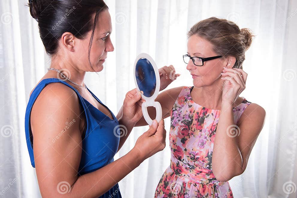 Two Attractive Women - Getting Ready for the Evening Stock Image ...