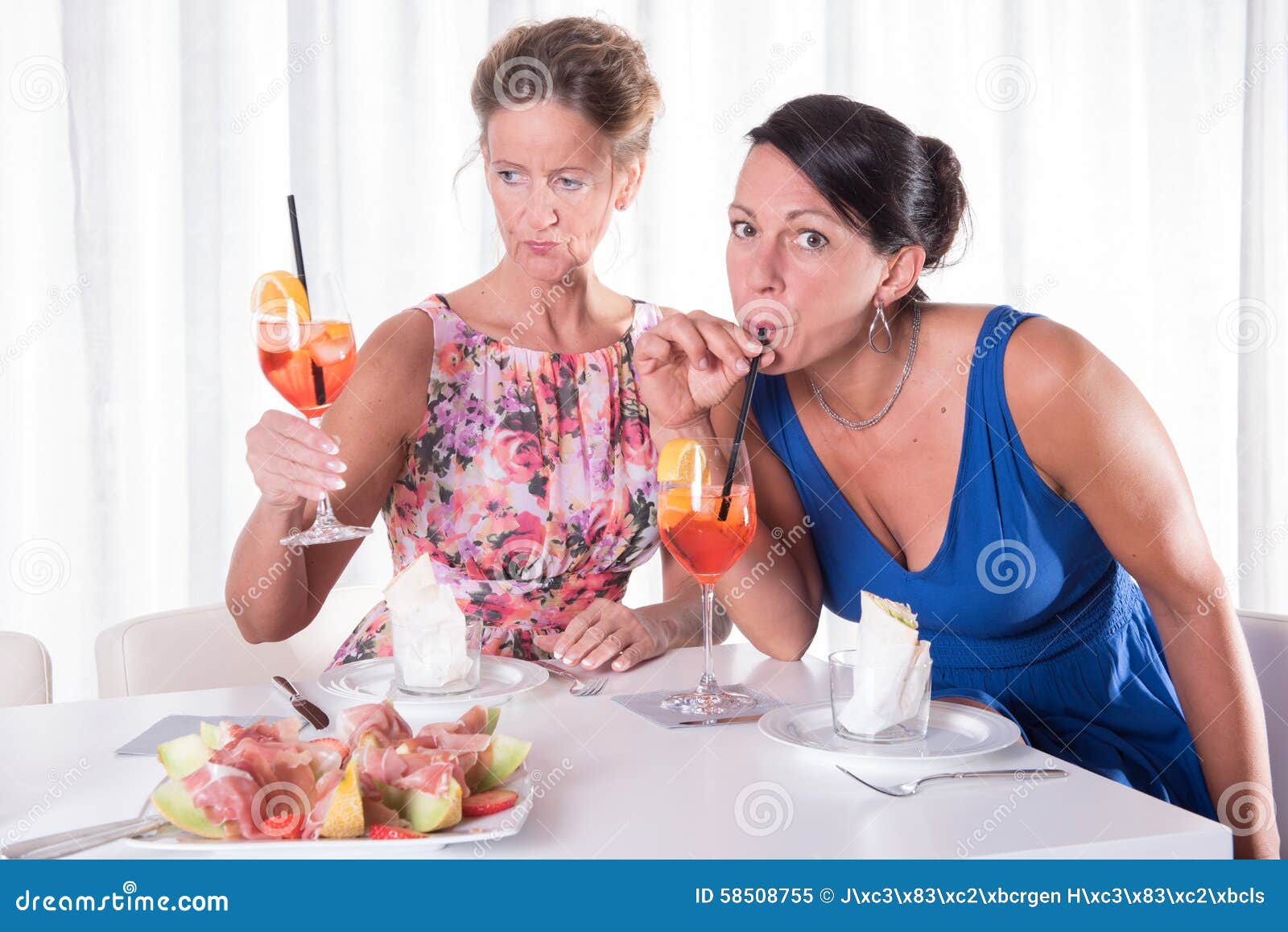 Two Attractive Women Having a Light Dinner Stock Image - Image of ...