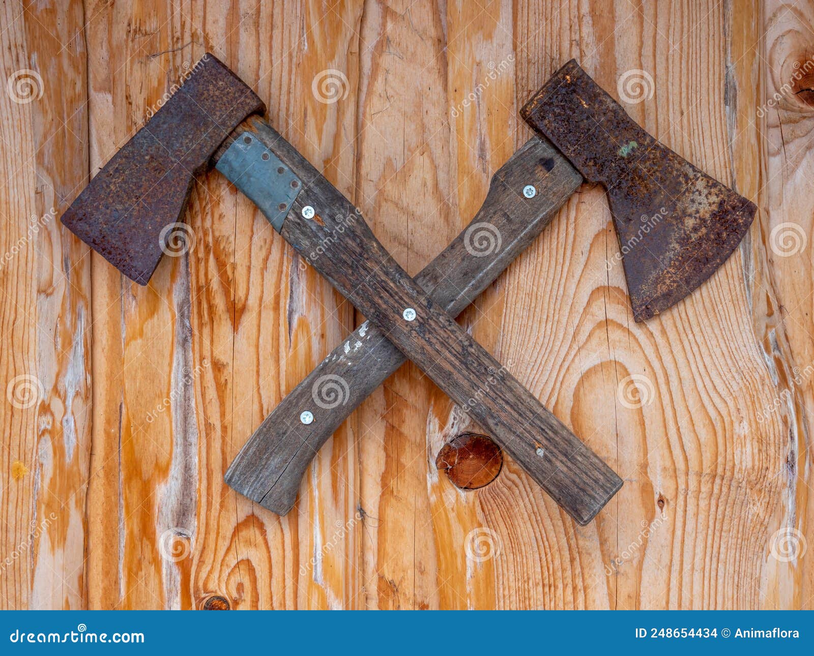 Two axes on a wooden wall stock photo. Image of life - 248654434