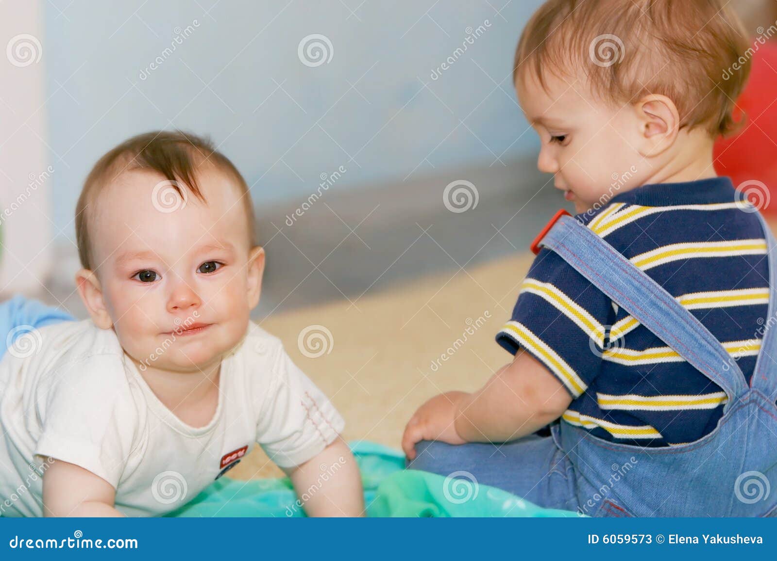 Two baby boys indoors stock image. Image of portrait, cheerful - 6059573