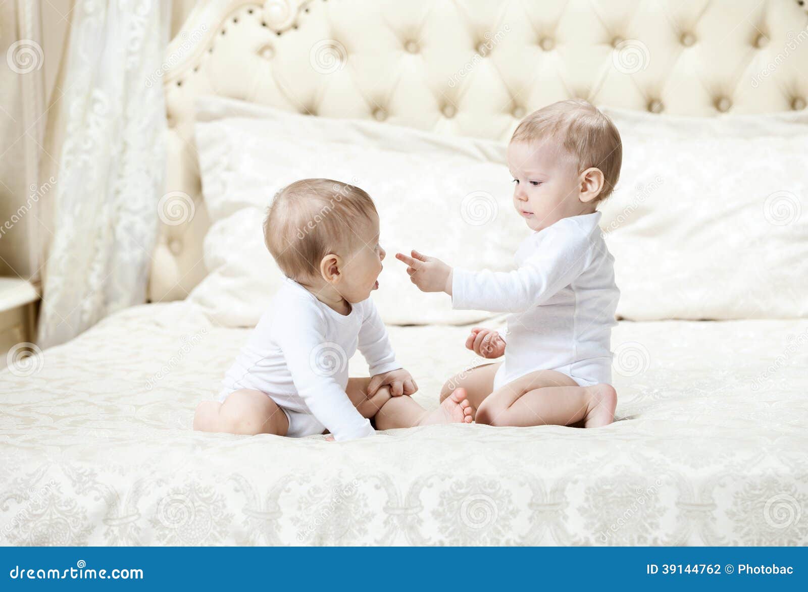 Two Baby Boys Playing on Bed Stock Photo - Image of childhood, playful ...