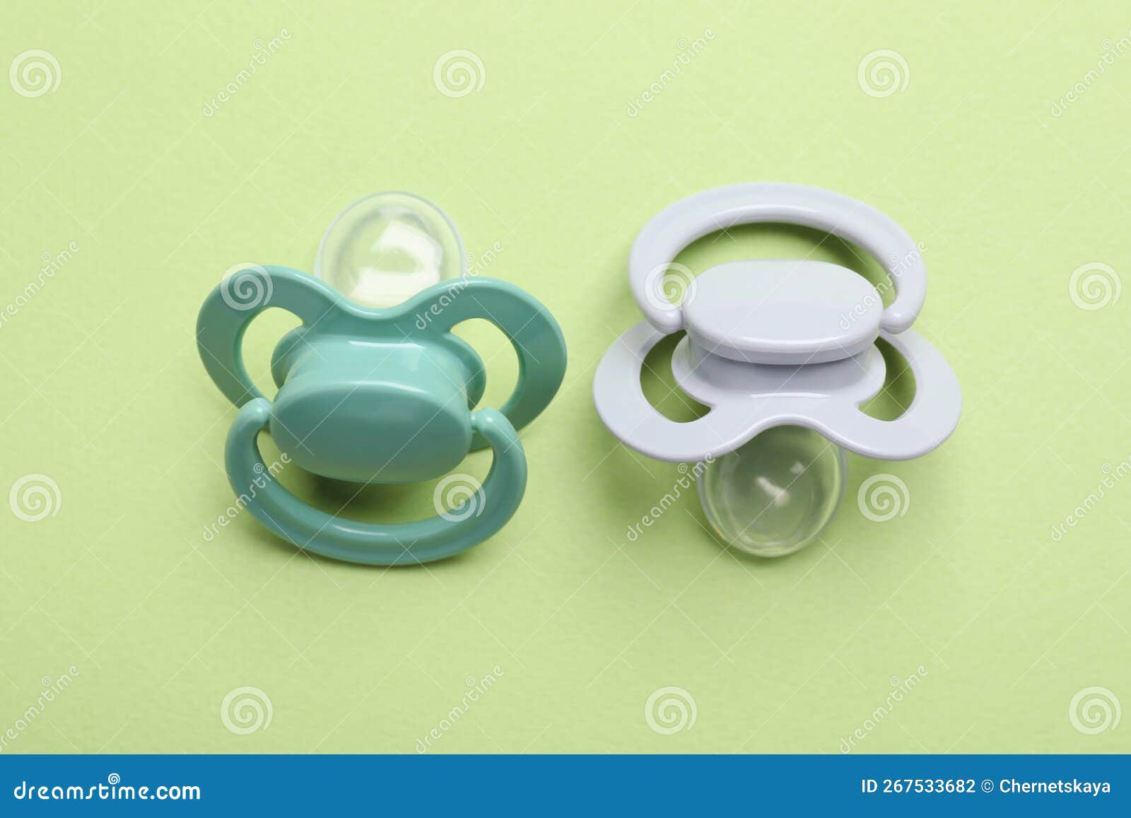 Two Baby Pacifiers on Pale Green Background Stock Photo - Image of ...