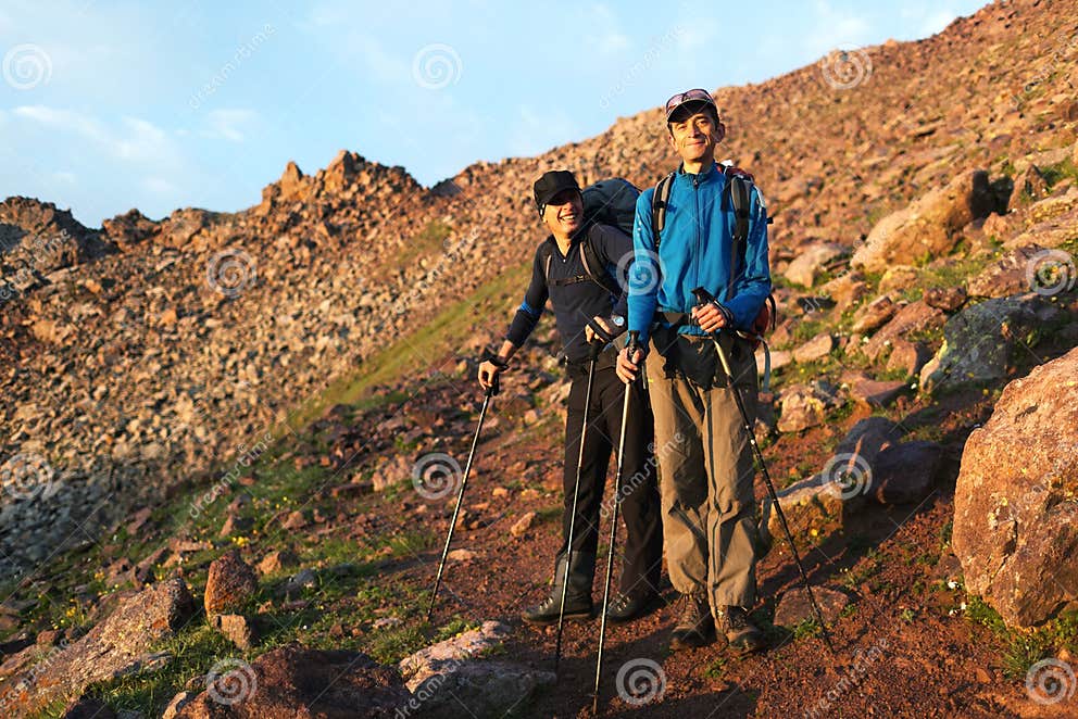 Two Backpackers in Mountains Stock Photo - Image of scenics, range ...