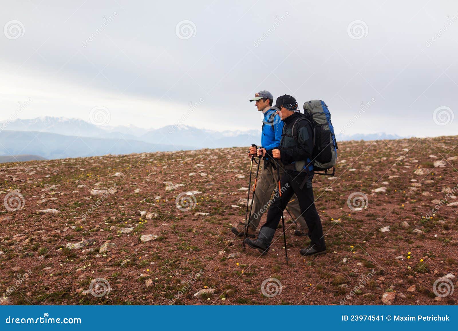 Two Backpackers in Mountains Stock Image - Image of carrying, mountains ...