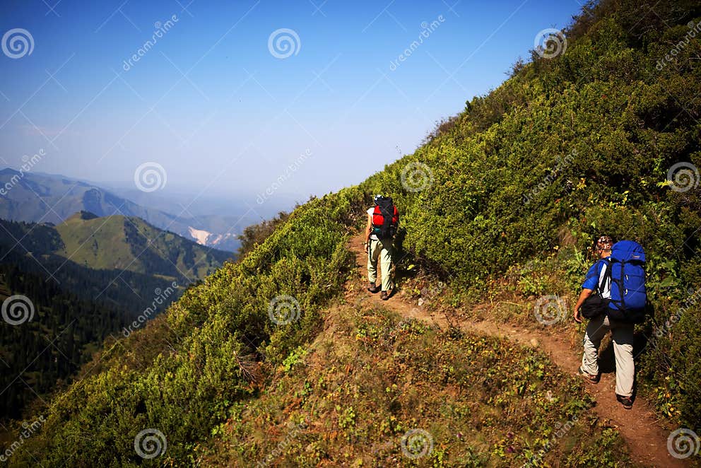 Two Backpackers in Mountains Stock Photo - Image of climbing, hiking ...