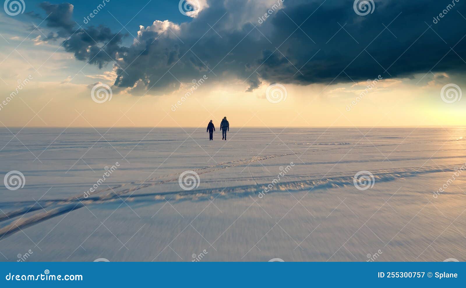The Two Backpackers Trekking through the Icy Snow Field. Stock Image ...