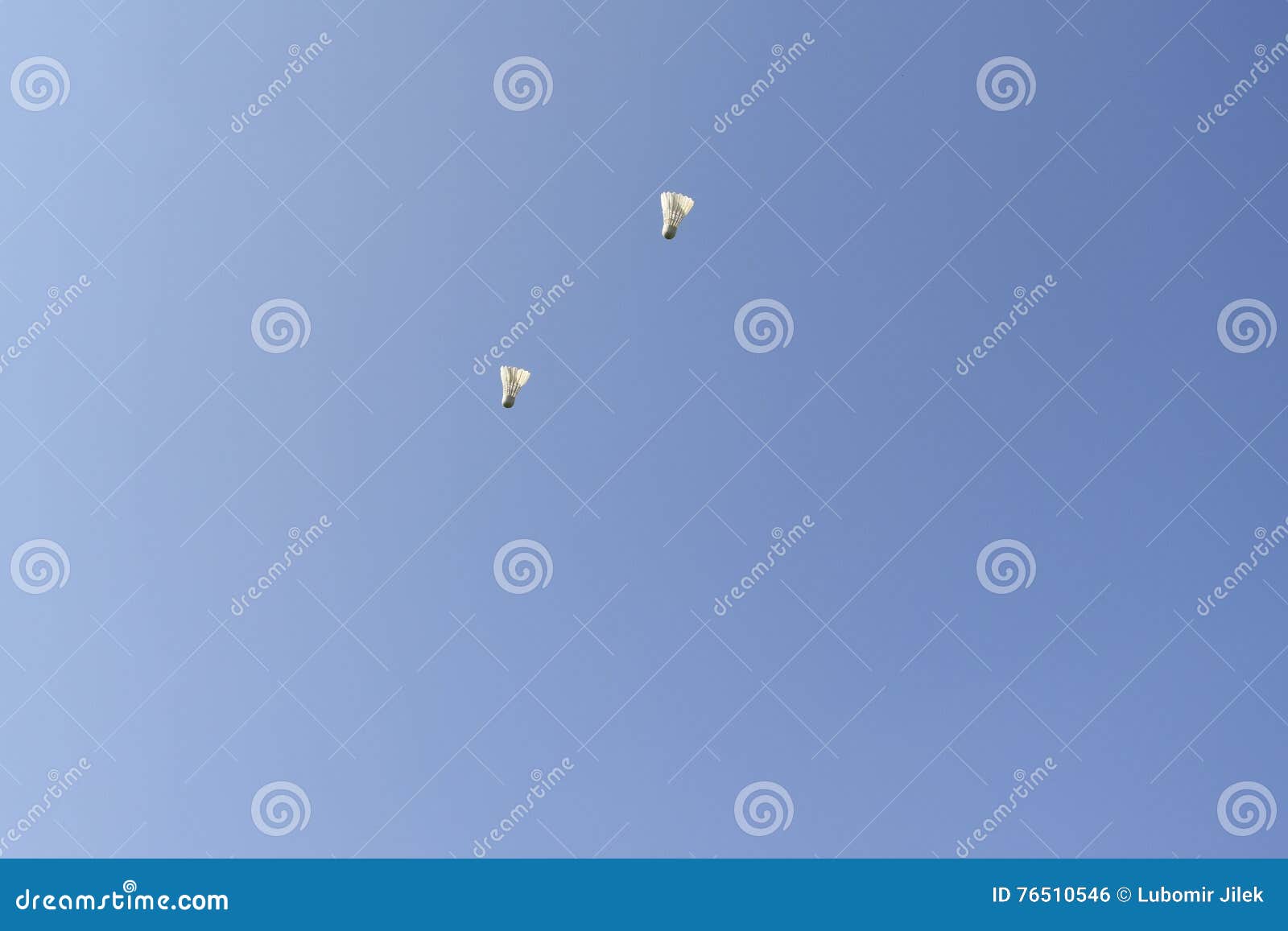 Two Badminton Balls Flying in the Blue Sky Stock Photo - Image of game ...